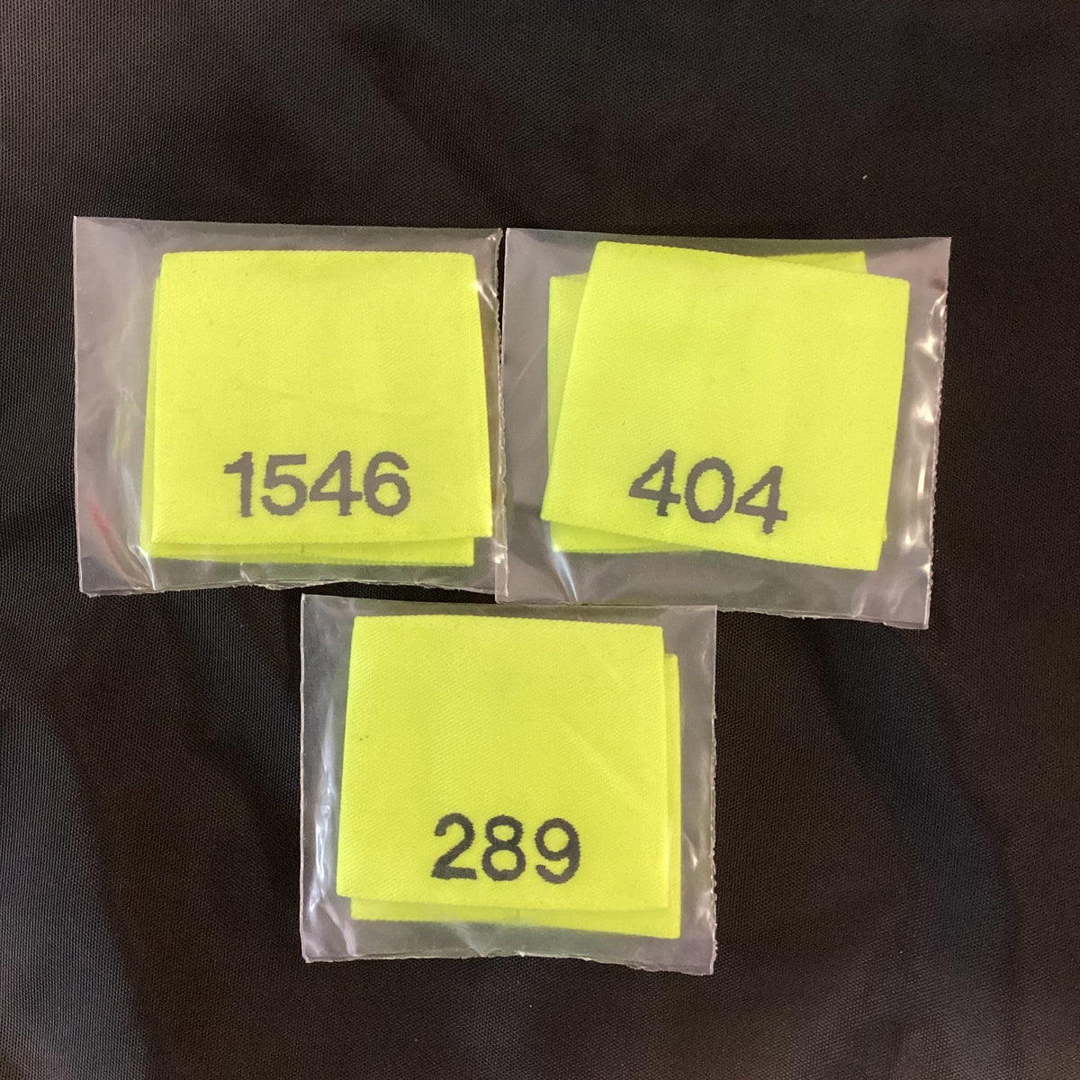 Epaulette Slides, Hi Vis yellow, black embroidered mixed numbers and l ...